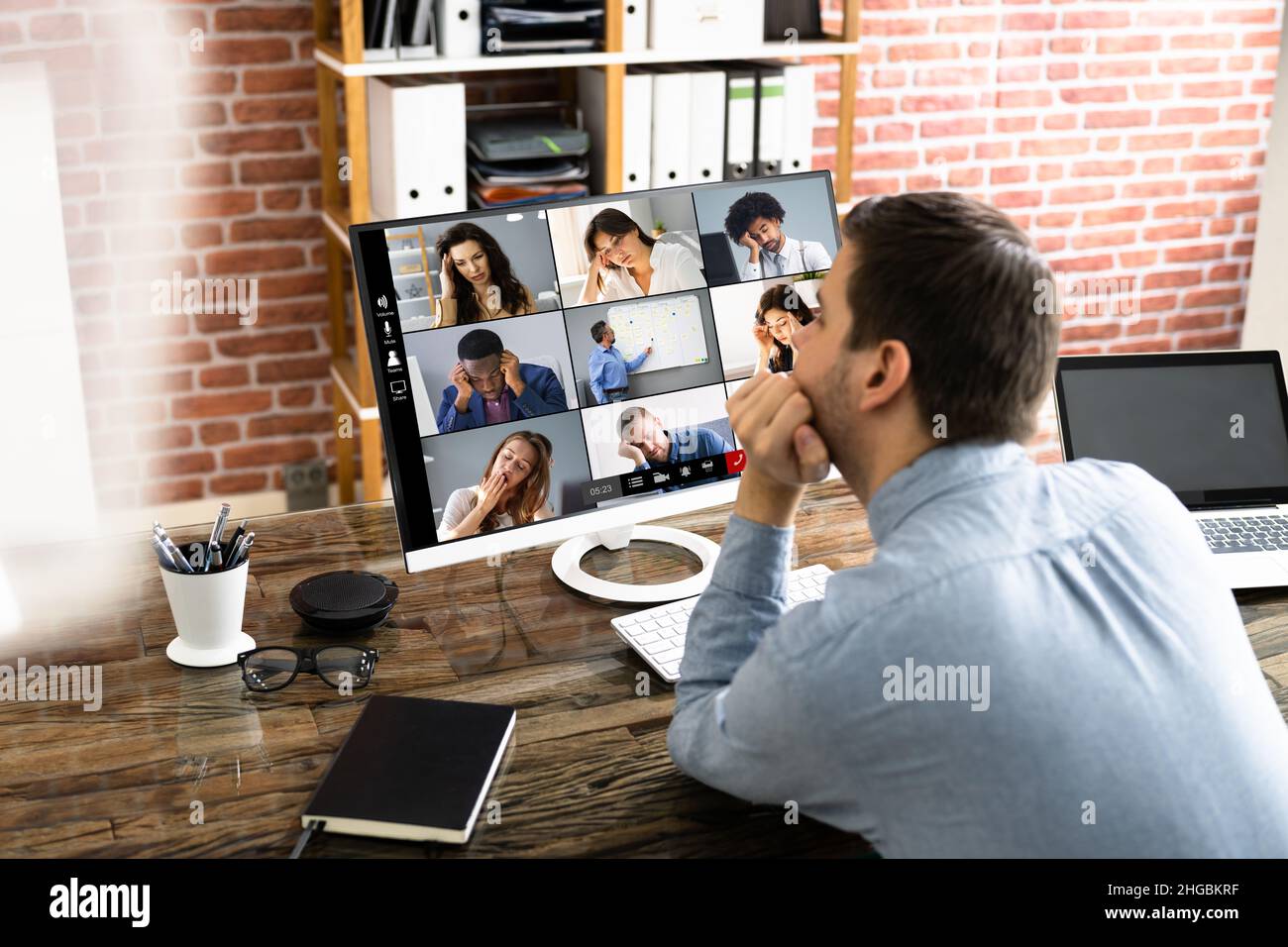 Bored Employee In Video Conference Training Meeting Stock Photo - Alamy