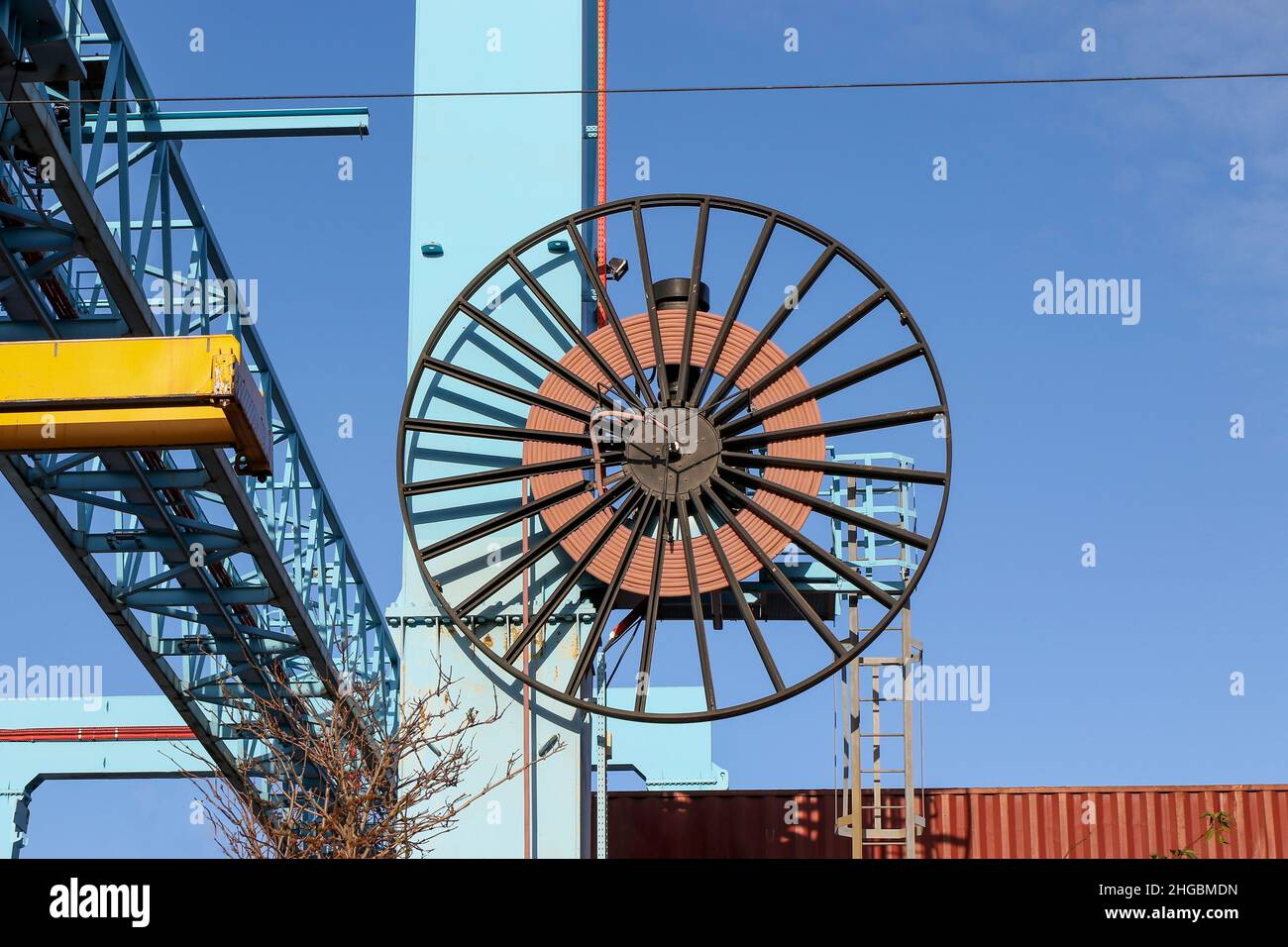 Cable reel of gantry crane in city docklands. Industrial equipment used ...