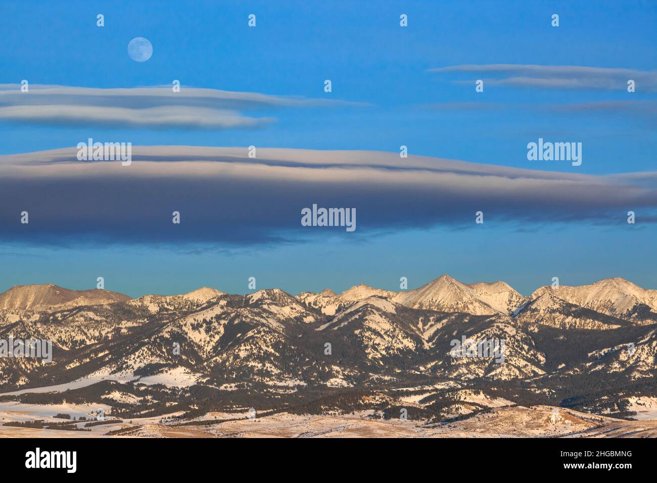 full moon over the crazy mountains in winter near wilsall, montana ...