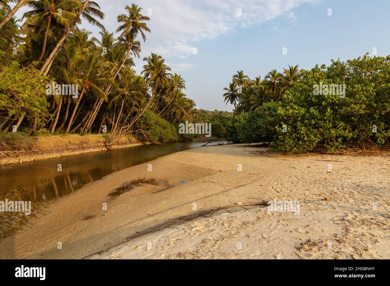 Beautiful view of narrow and shallow river which meets the sea at ...
