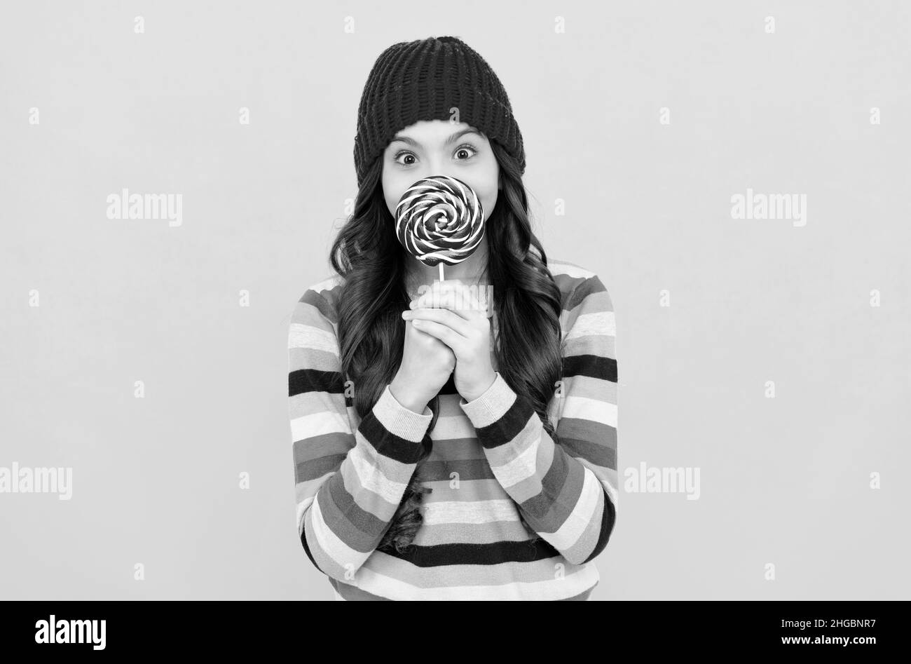surprised teen girl with lollipop candy, sugar candy Stock Photo - Alamy
