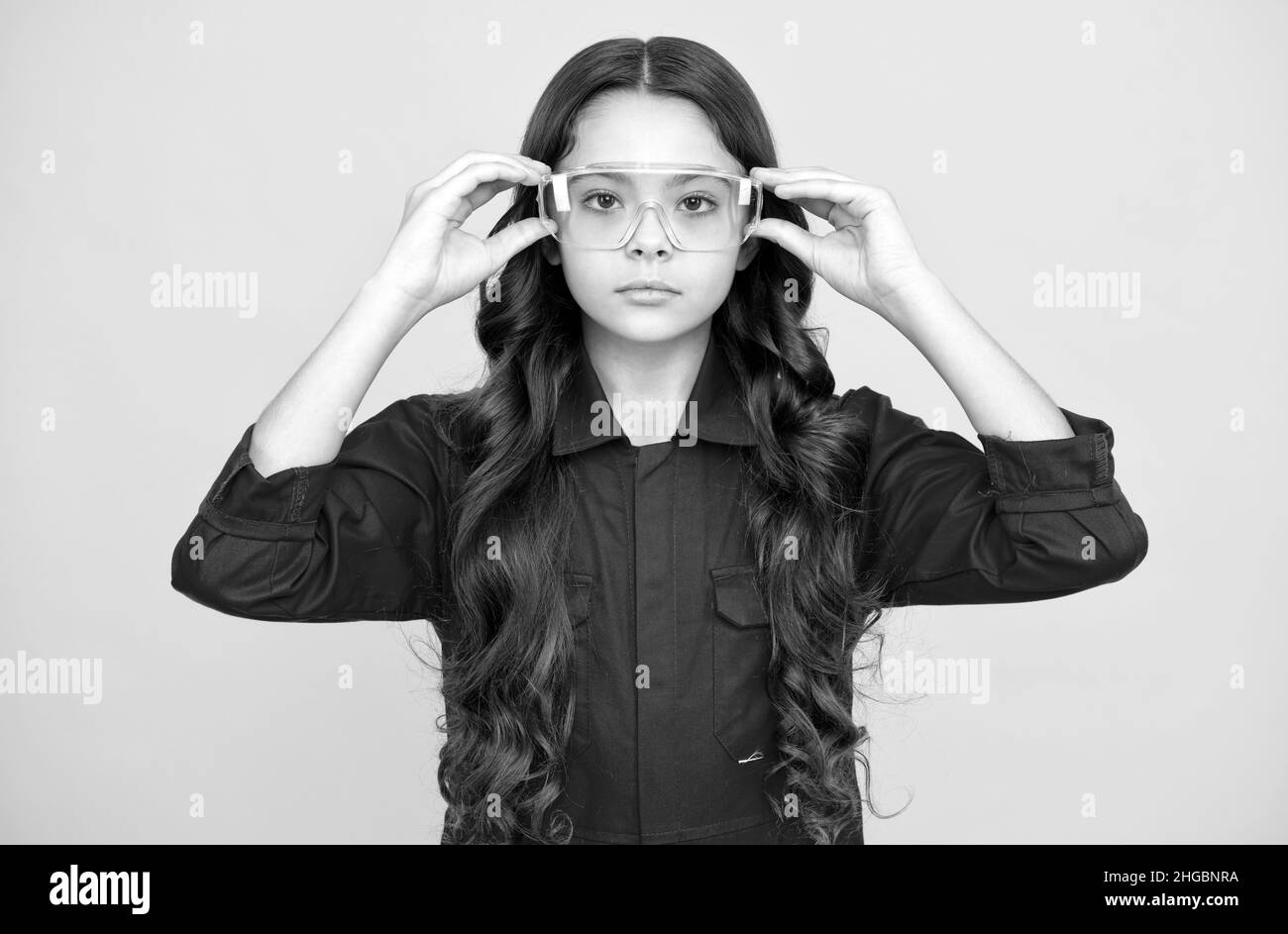 try on these glasses. child having bad vision. eye protection. serious ...