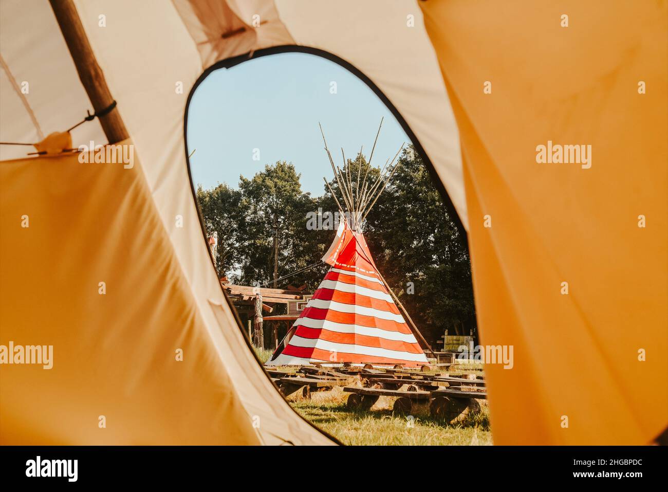 Tipi house in the forest against the background of trees, camping ...