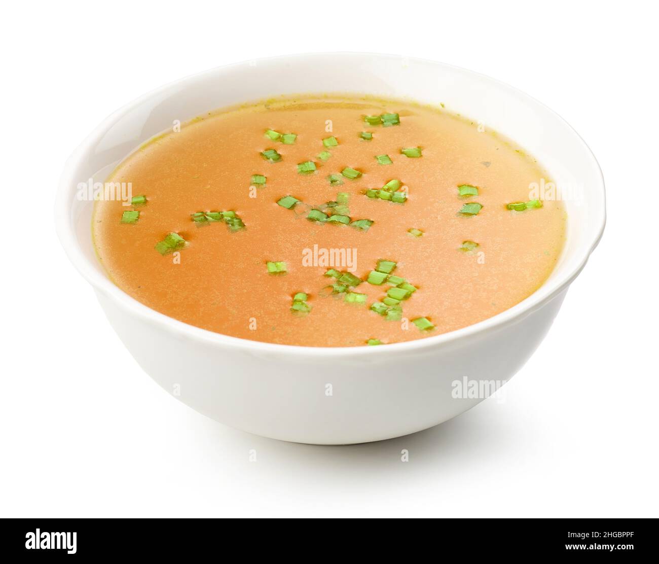 bowl of chicken broth with chopped green onions isolated on white ...