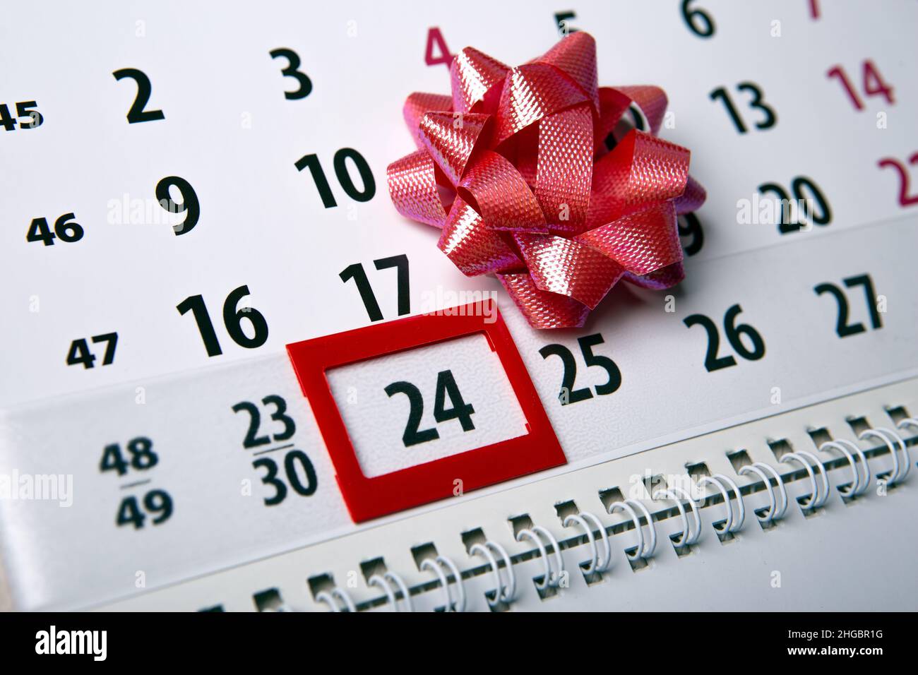 wall calendar with day 24 december and festive bow Stock Photo - Alamy