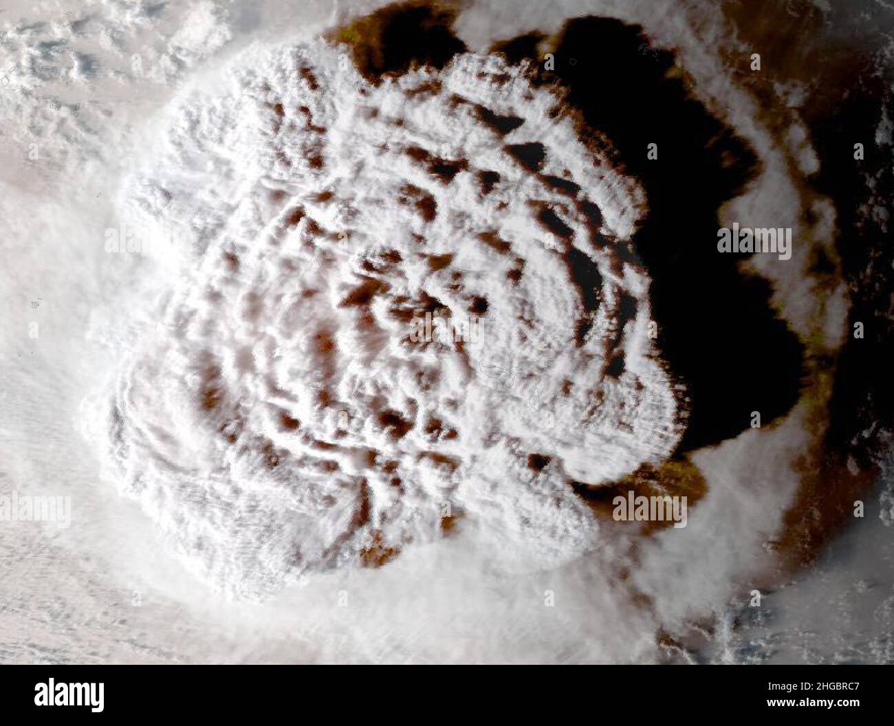 A massive mushroom cloud blasts volcanic ash from the violent eruption ...