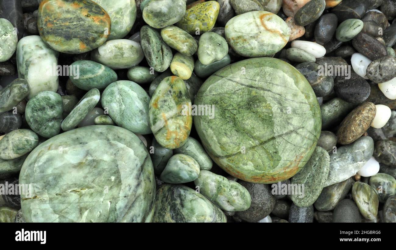 Round greenish beach stones on the West Coast, New Zealand Stock Photo ...