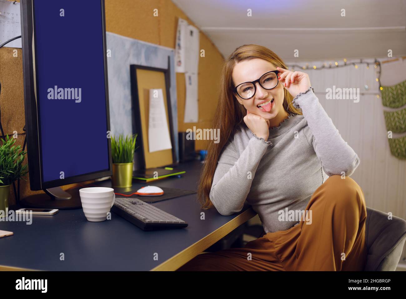 Stay home, a chic girl works in a homely atmosphere. Girl freelancer ...