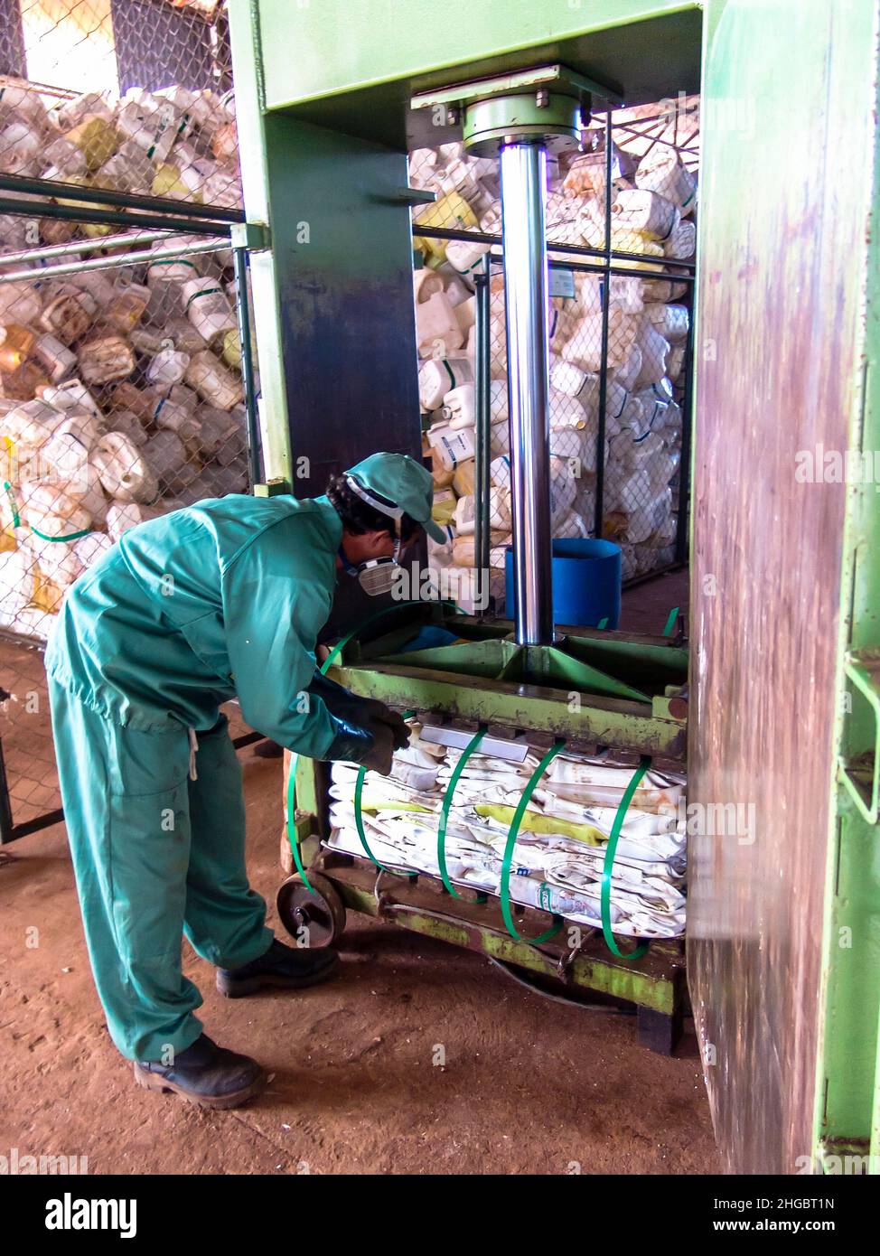 Piracicaba, Sao Paulo, Brazil, July 06, 2007. Worker presses plastic ...