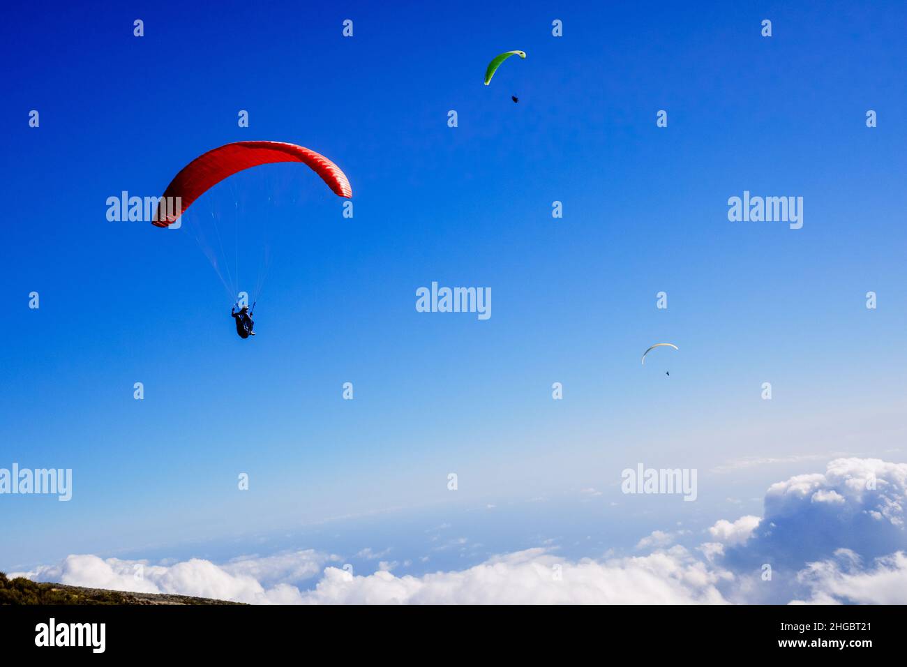 Athletes use an ultralight flexible glider, paraglider, to fly above ...