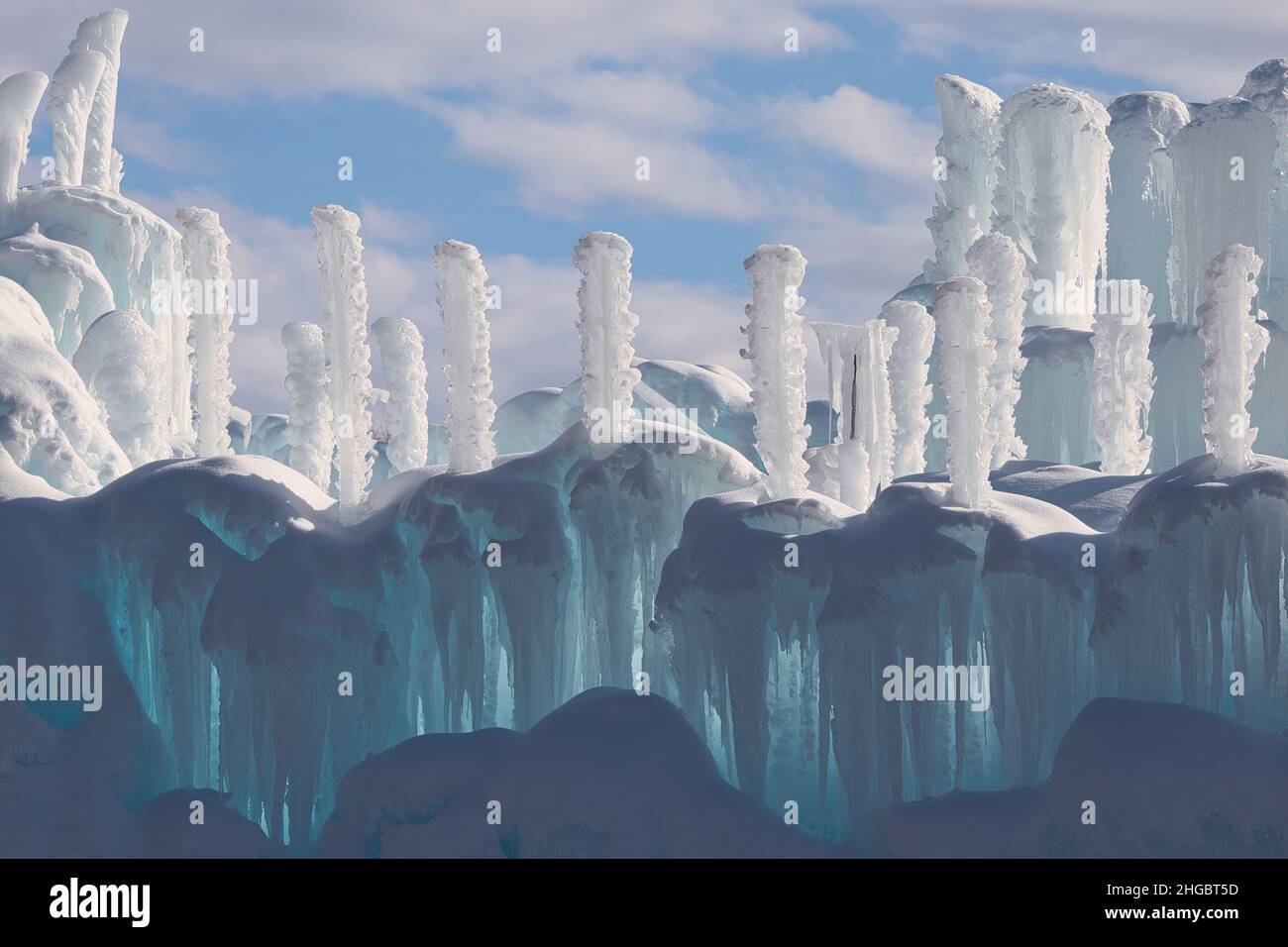 Ice Castle spires reaching into a blue sky with clouds in winter Stock ...