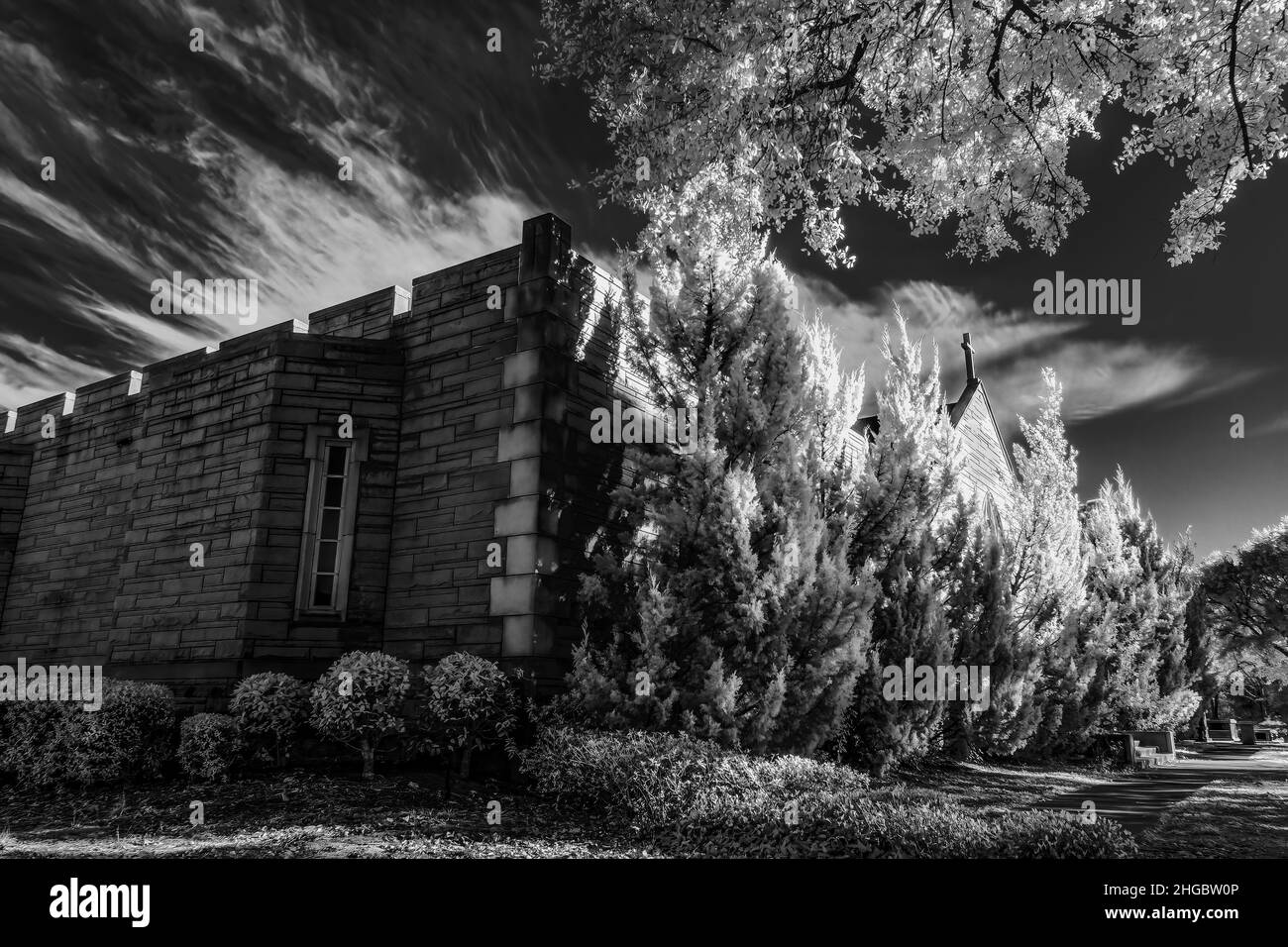 Infrared Photography of cemetery landscape with a crypt and trees ...