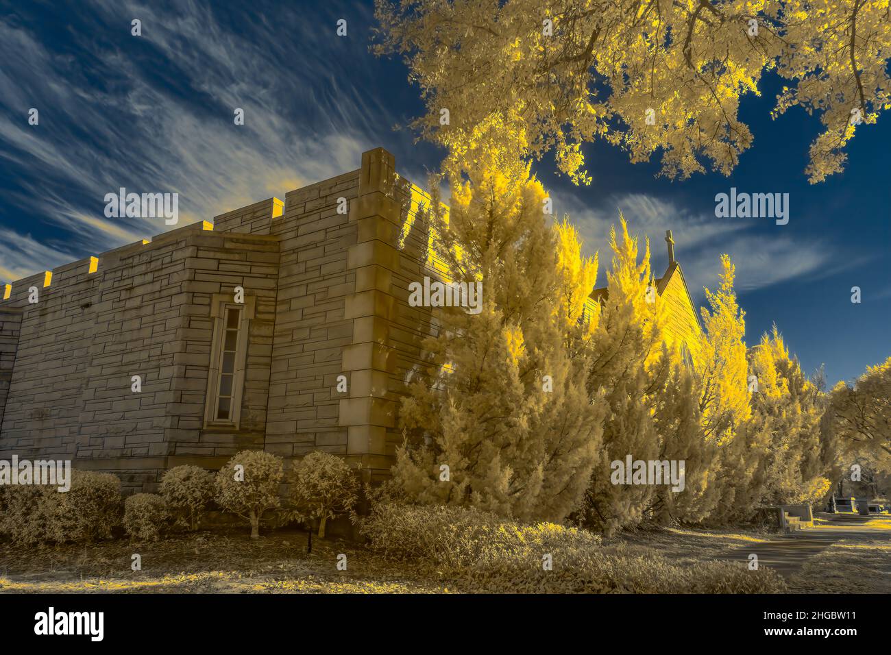 Infrared Photography of cemetery landscape with a crypt and trees ...