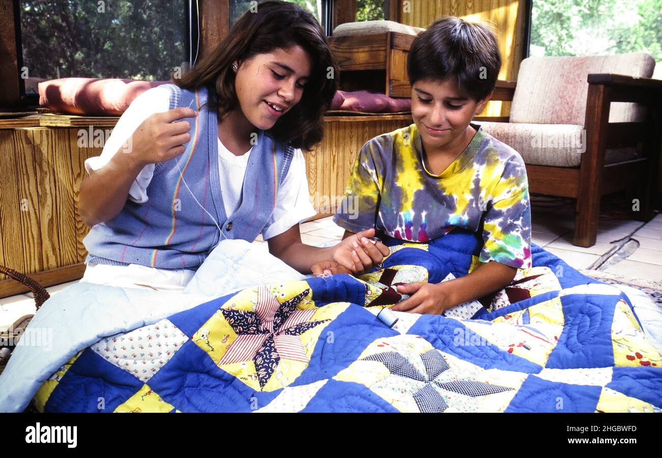 Austin, Texas USA: Hispanic children working on a quilt. MR RE-0255 ...