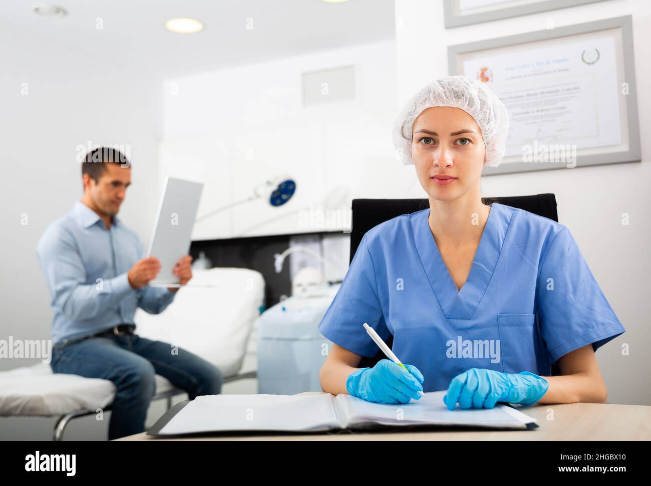 Woman beautician writing notes hi-res stock photography and images - Alamy