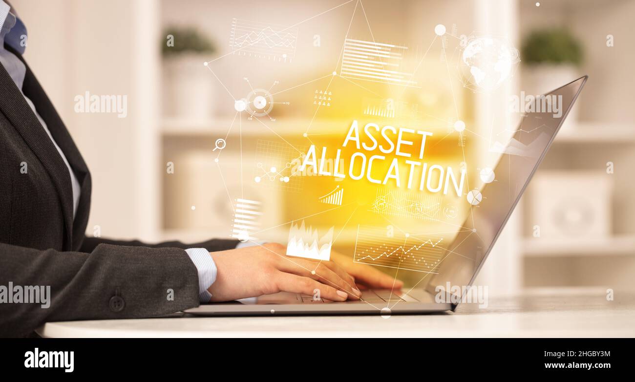 Side view of a business person working on laptop Stock Photo - Alamy