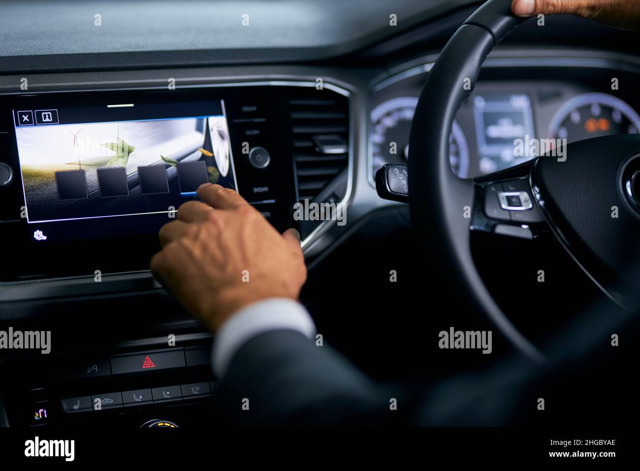 Close up of man in suit tapping with finger on multimedia screen of ...