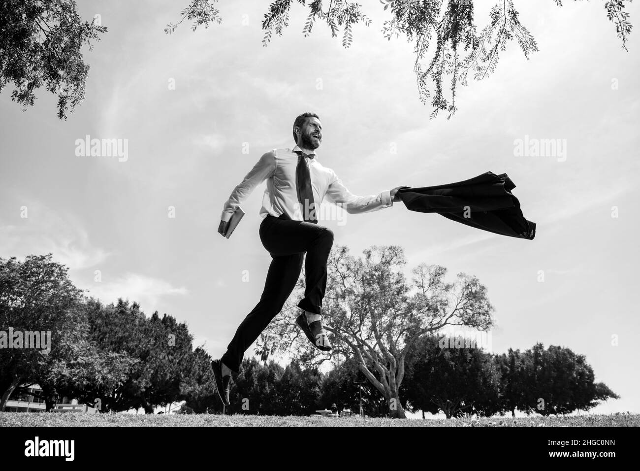 Excited businessman running fast, racing and jumping Stock Photo - Alamy