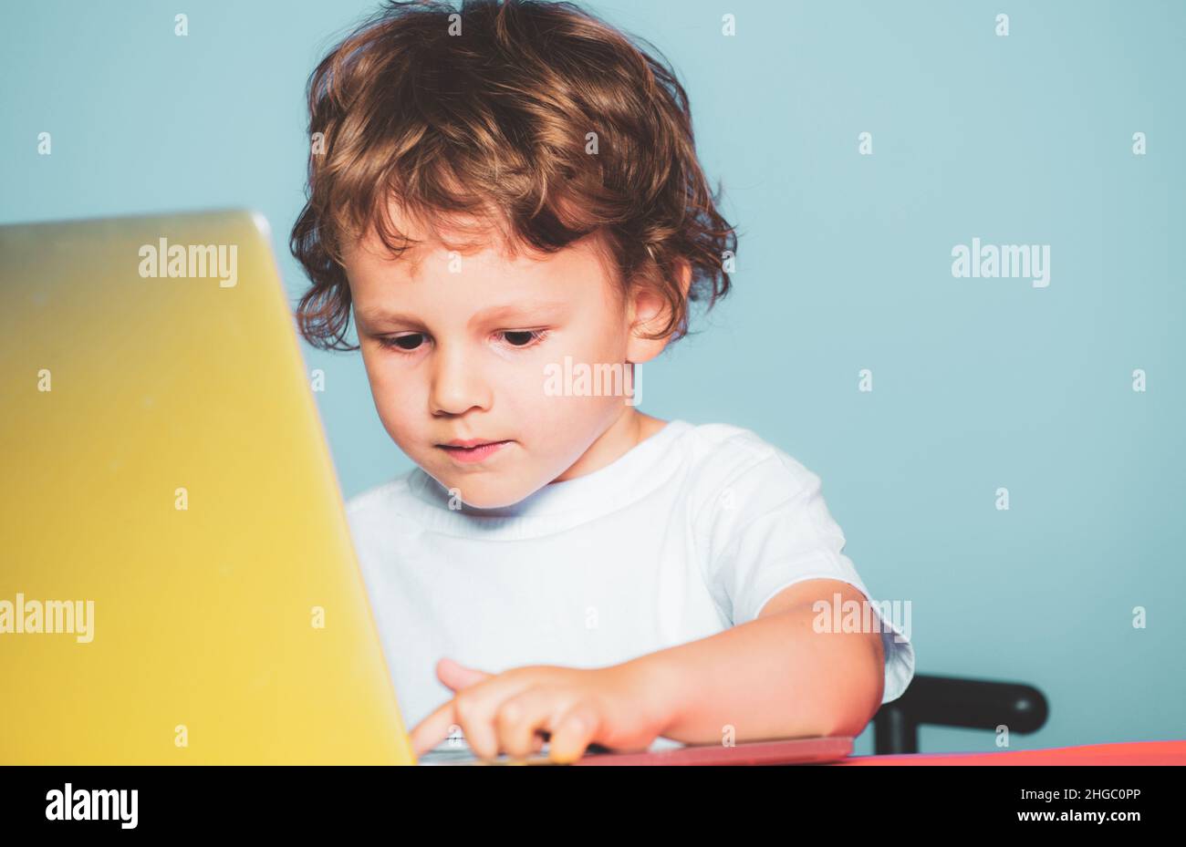 Kid school. Child is ready to answer with a blackboard on a background ...