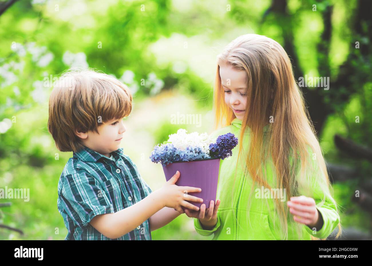Children planting together. Two little children on countryside farm ...