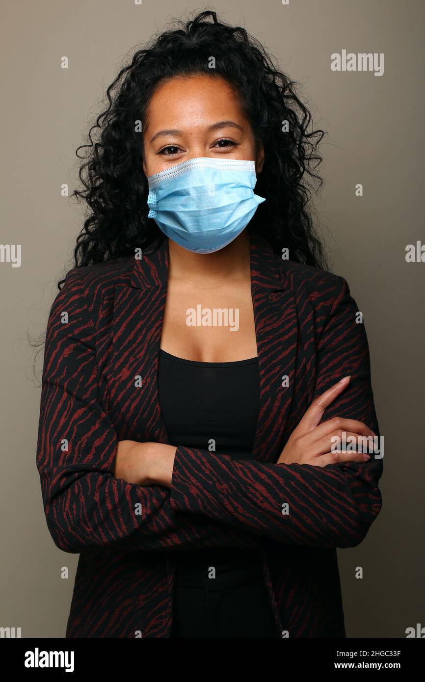Beautiful woman wearing a mouth mask Stock Photo - Alamy