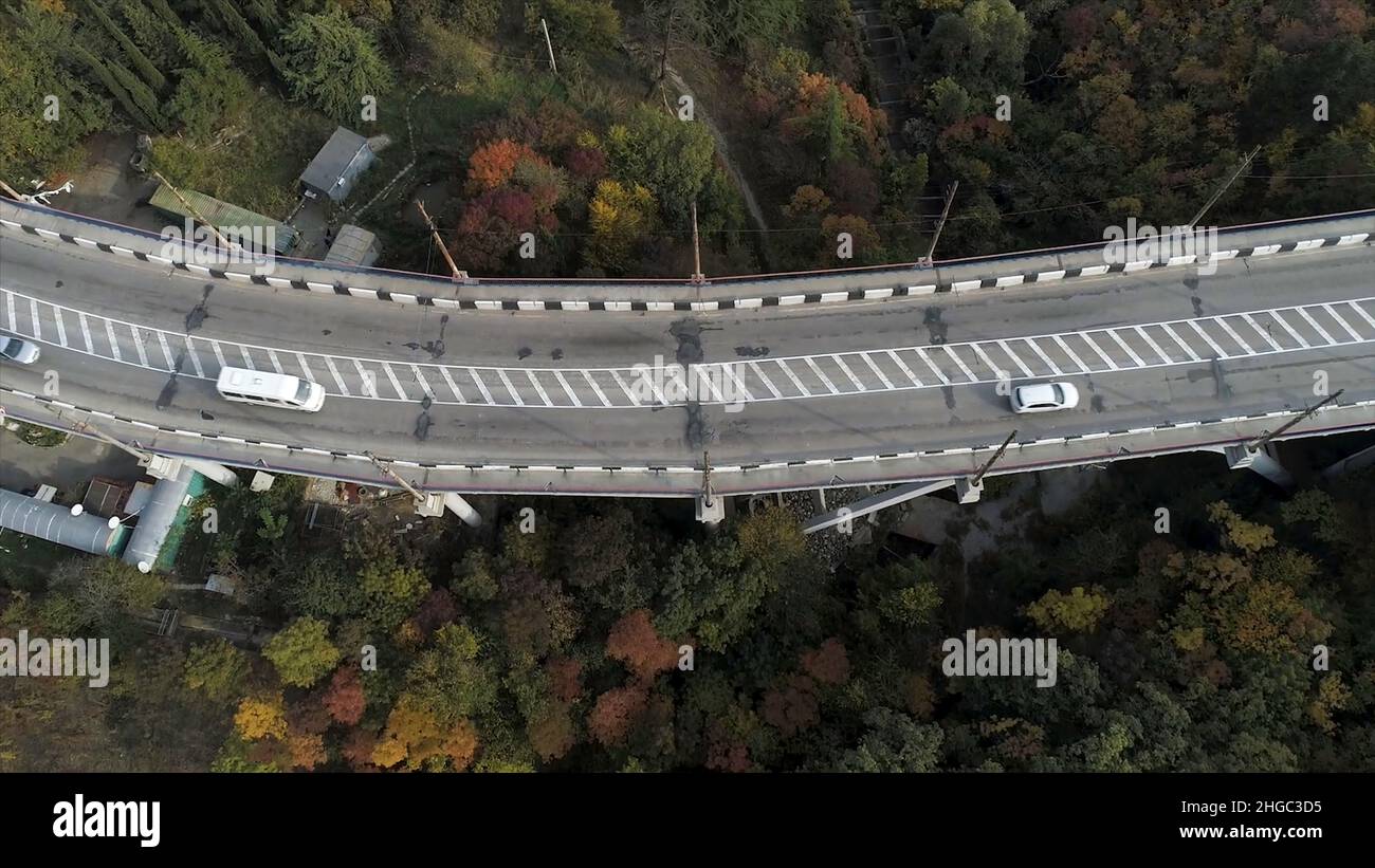 Top view on overpass with driving cars, sea and beautiful landscape ...