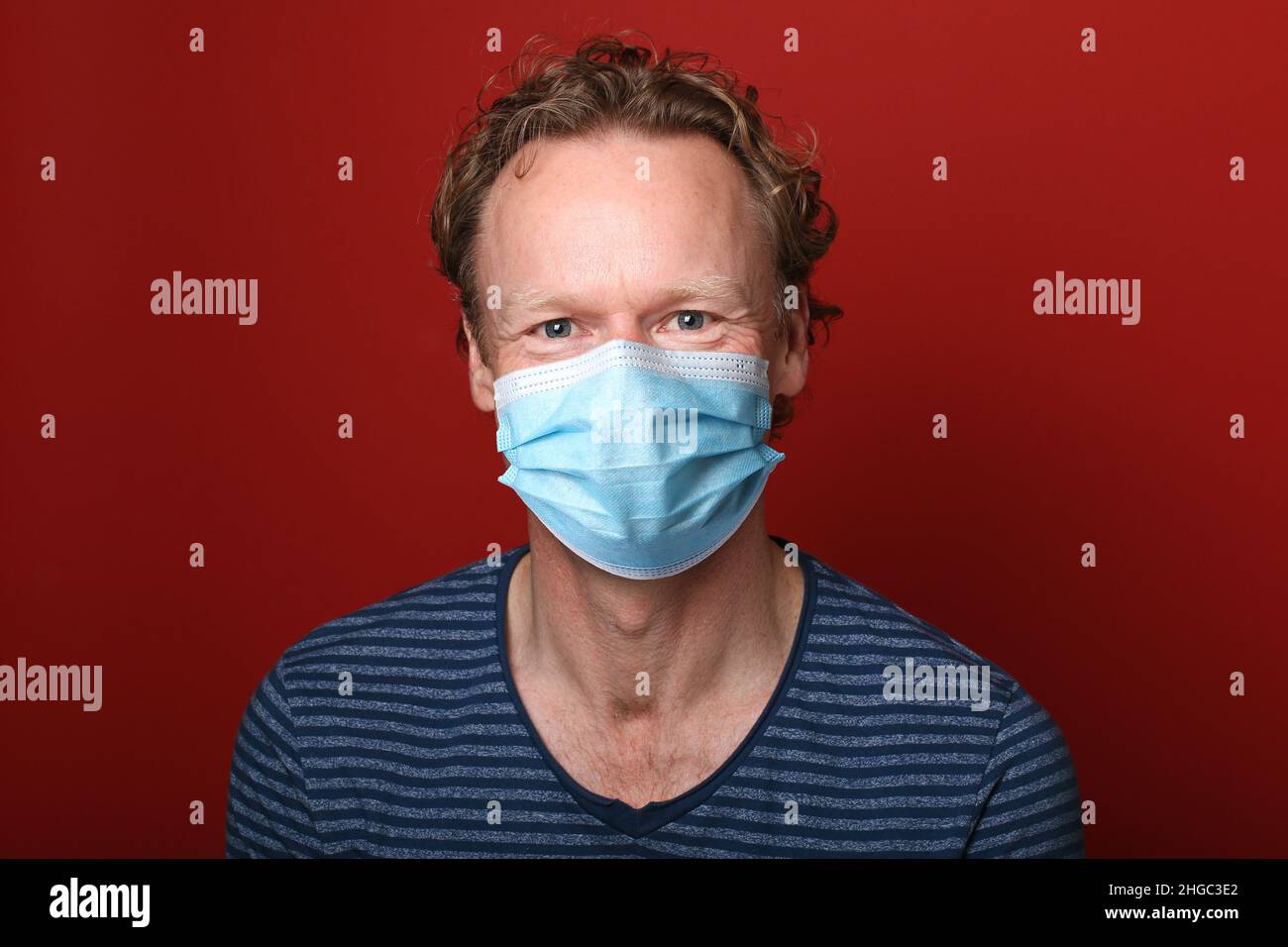 Beautiful man wearing a mouth mask Stock Photo - Alamy