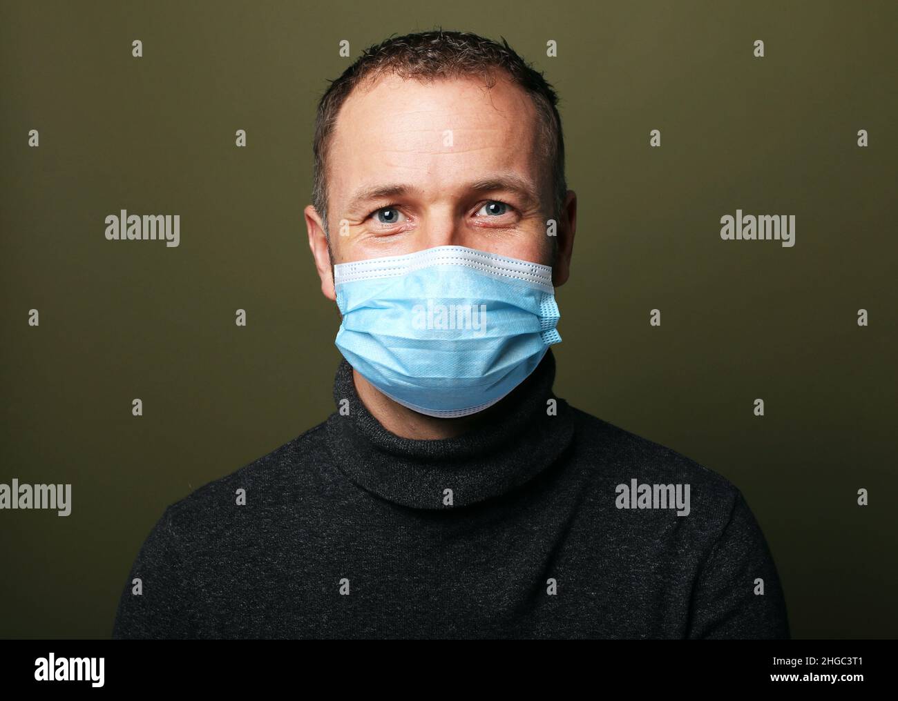 Beautiful man wearing a mouth mask Stock Photo - Alamy