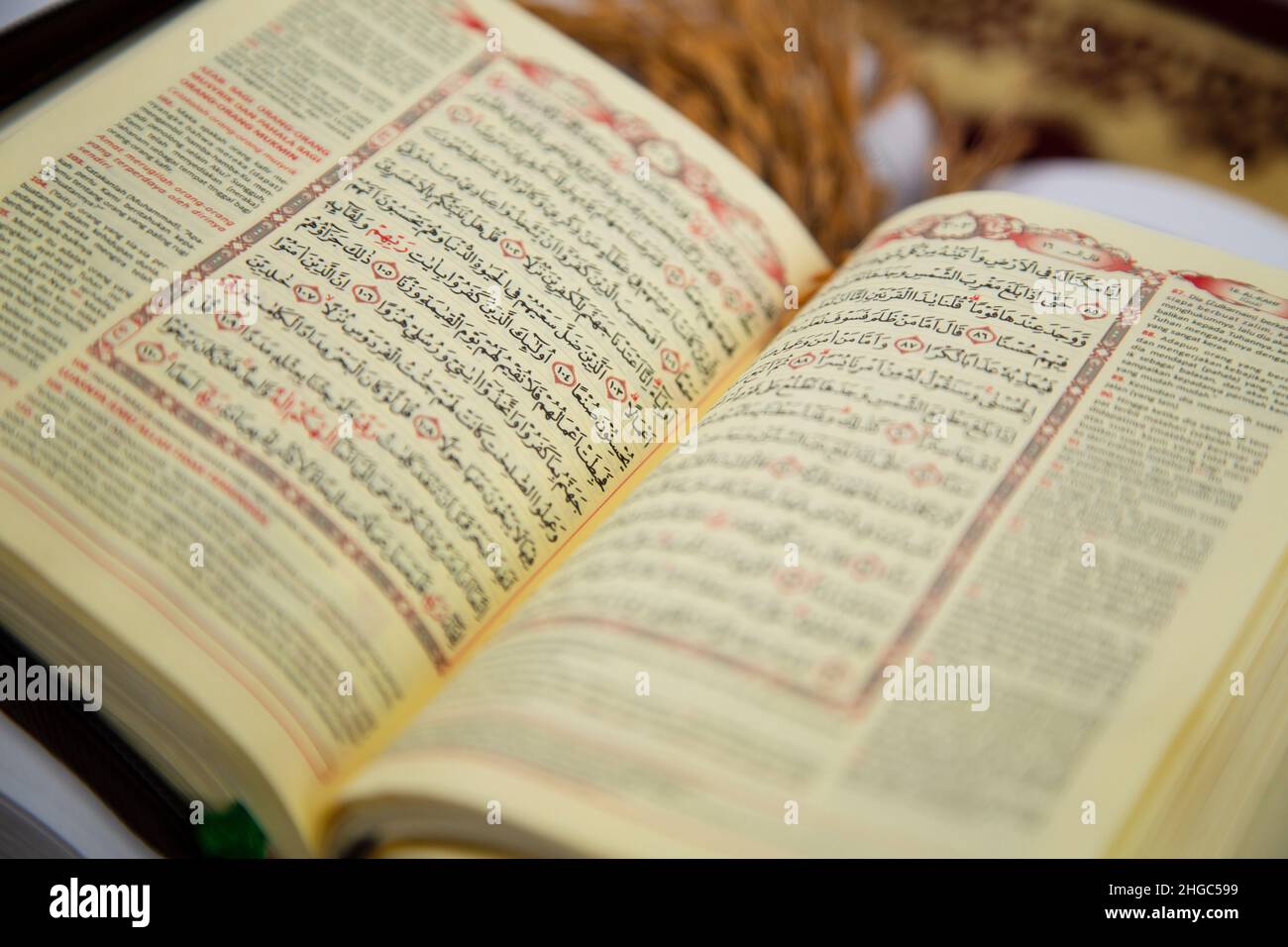 An Open Al Quran with Translation in Extreme Close Up Stock Photo - Alamy