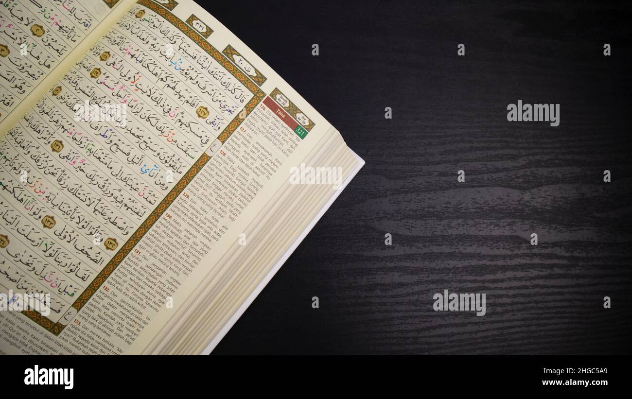An Open Holy Quran Black Background Stock Photo - Alamy