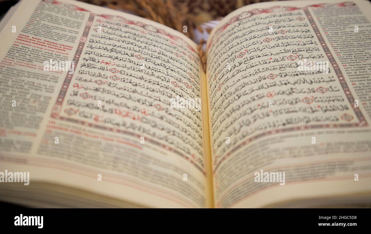 An Open Holy Quran Verses Detailed Extreme Close Up Stock Photo - Alamy