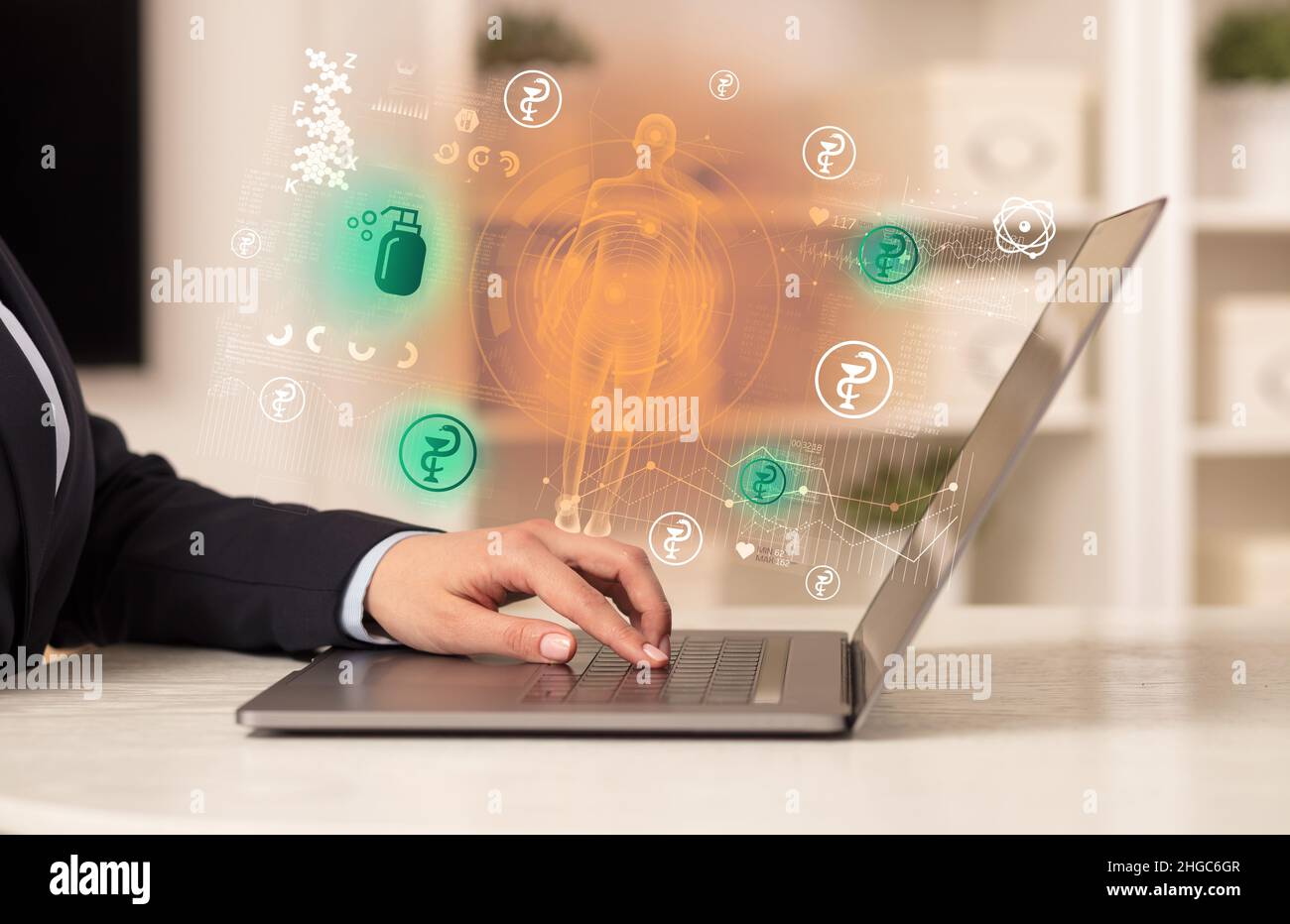 Doctor working on laptop with healthcare concept Stock Photo - Alamy