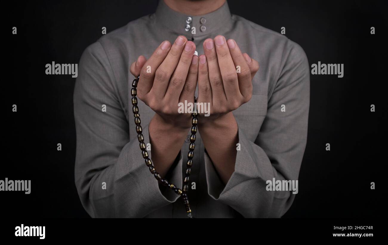 Muslim Man Praying Making Dua with Both Hands and Prayer Beads Stock ...