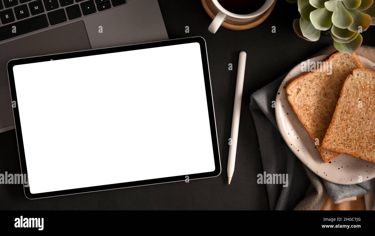Minimal dark workspace with digital tablet touchpad computer white ...