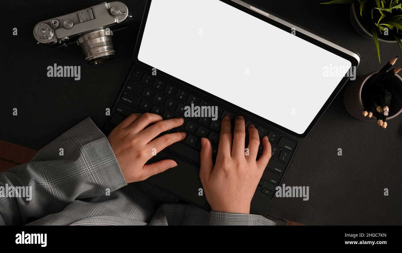 Top view of a female freelance photographer working on her portable ...