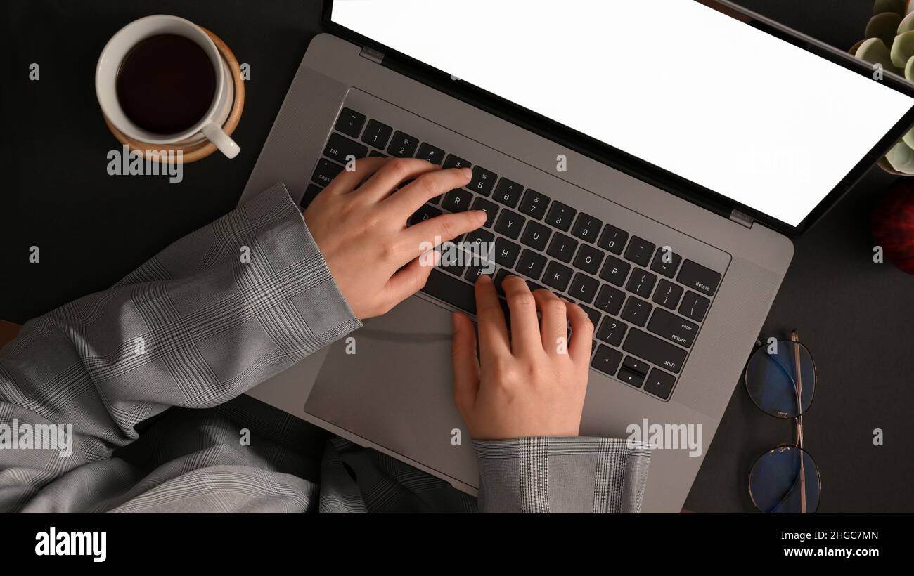 Top view of a professional businesswoman in a formal suit working on ...