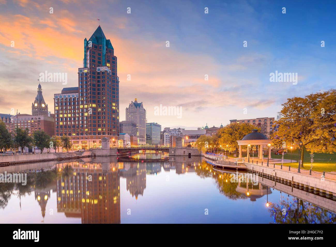Downtown skyline with Buildings along the Milwaukee River at night, in ...