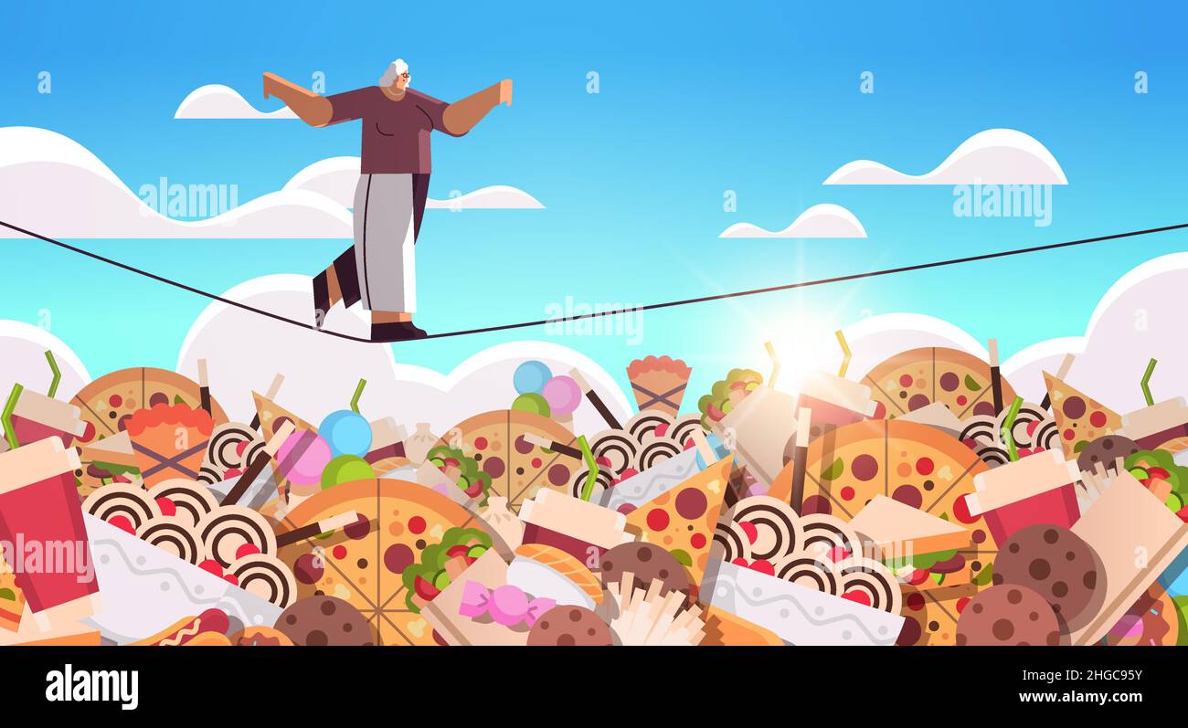 senior woman balancing on rope above junk food assortment of fast food ...