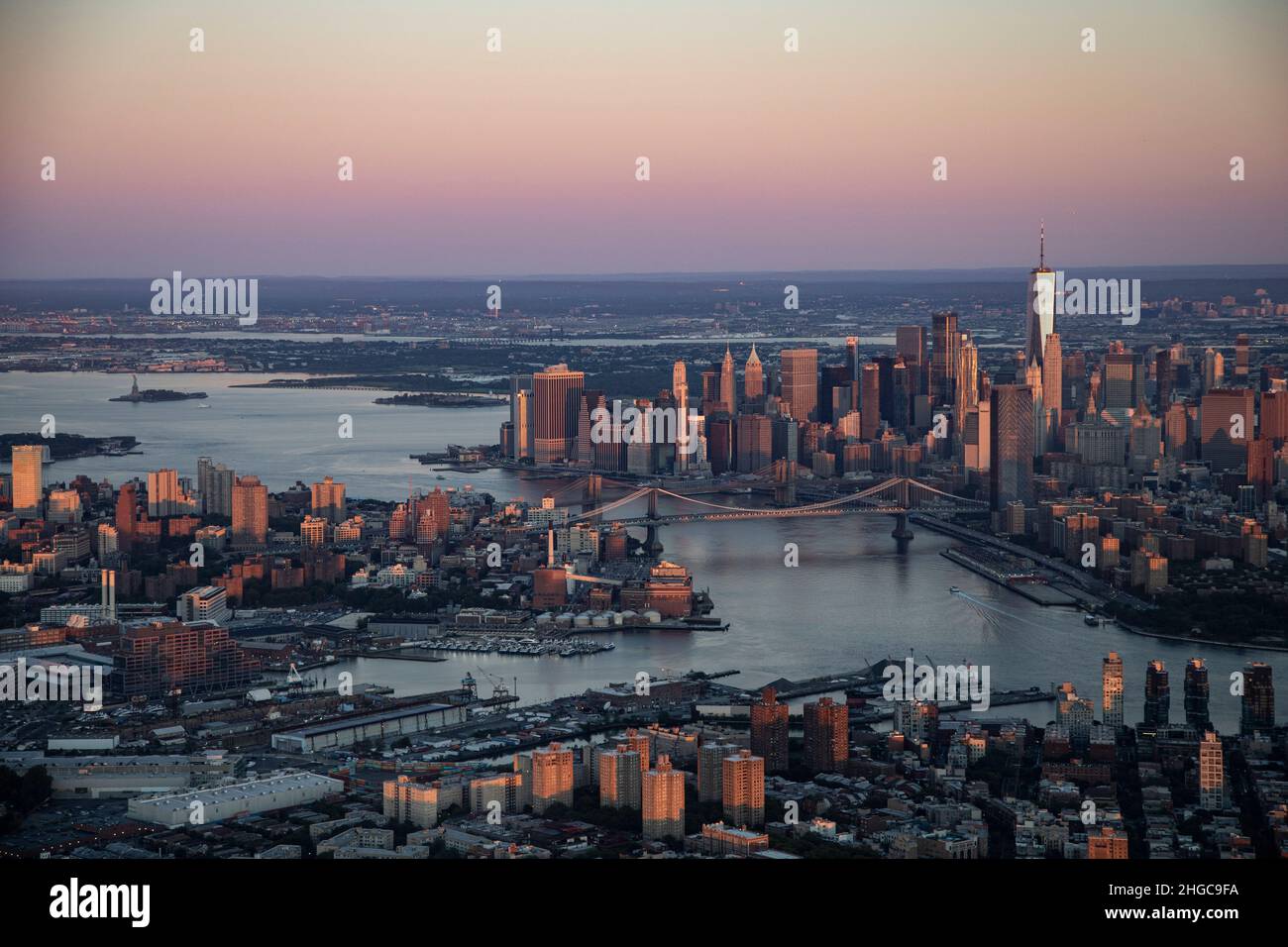 A sunrise aerial view of parts of Queens, Brooklyn and Manhattan, shot ...