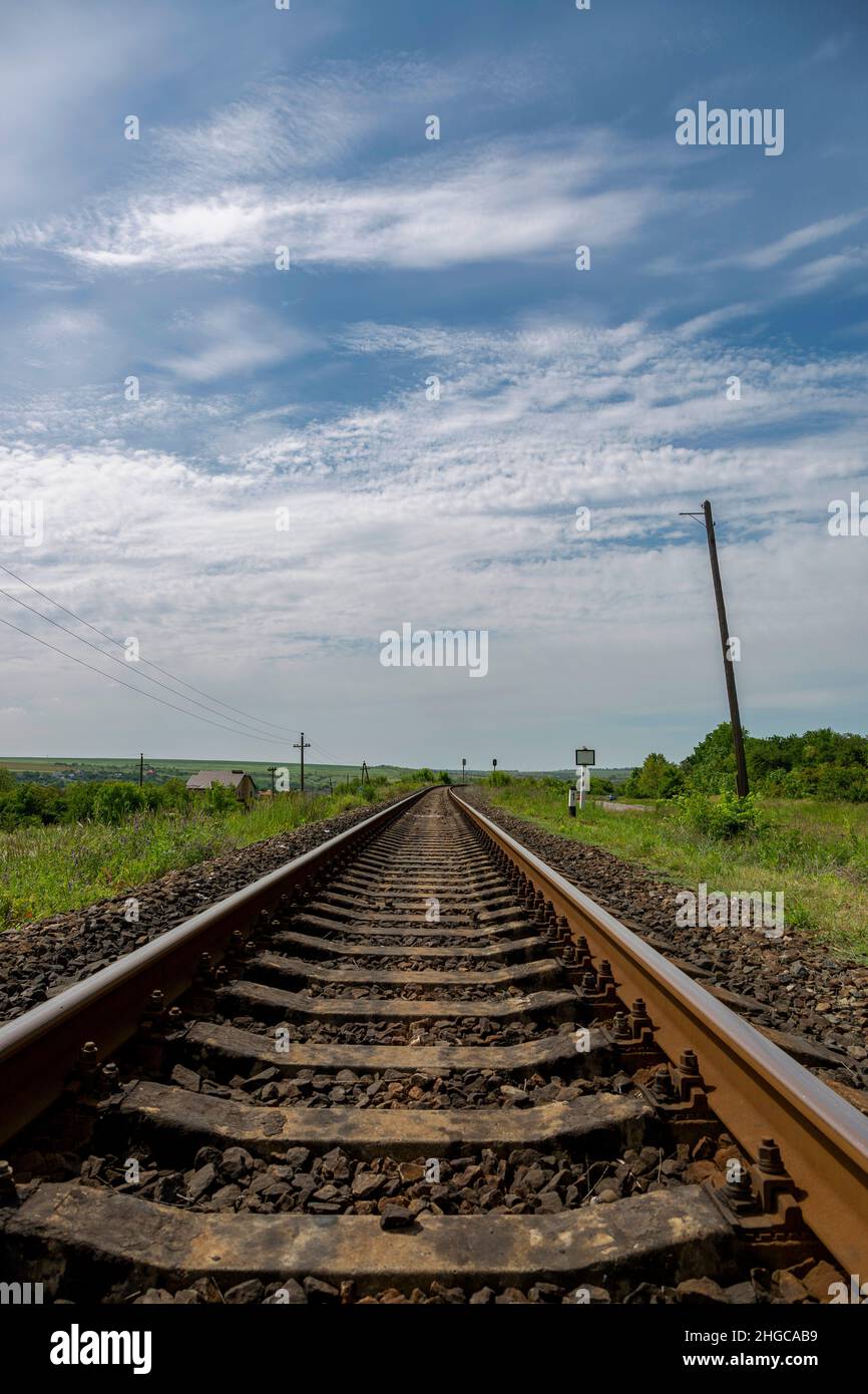 Summer landscape with railroad rails and road Stock Photo - Alamy