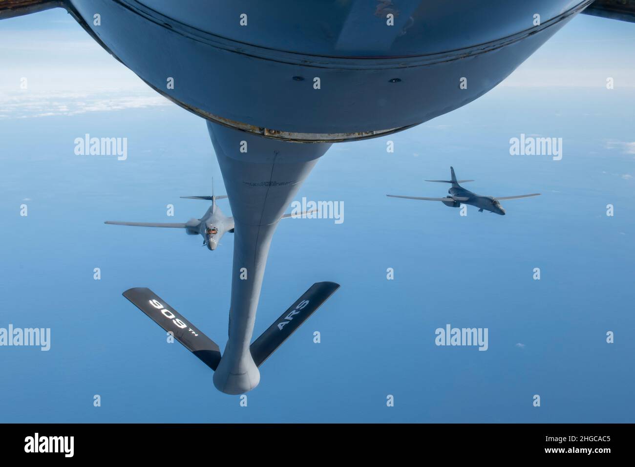 Two B-1 Lancers from the 7th Bomb Wing fly behind A KC-135R ...