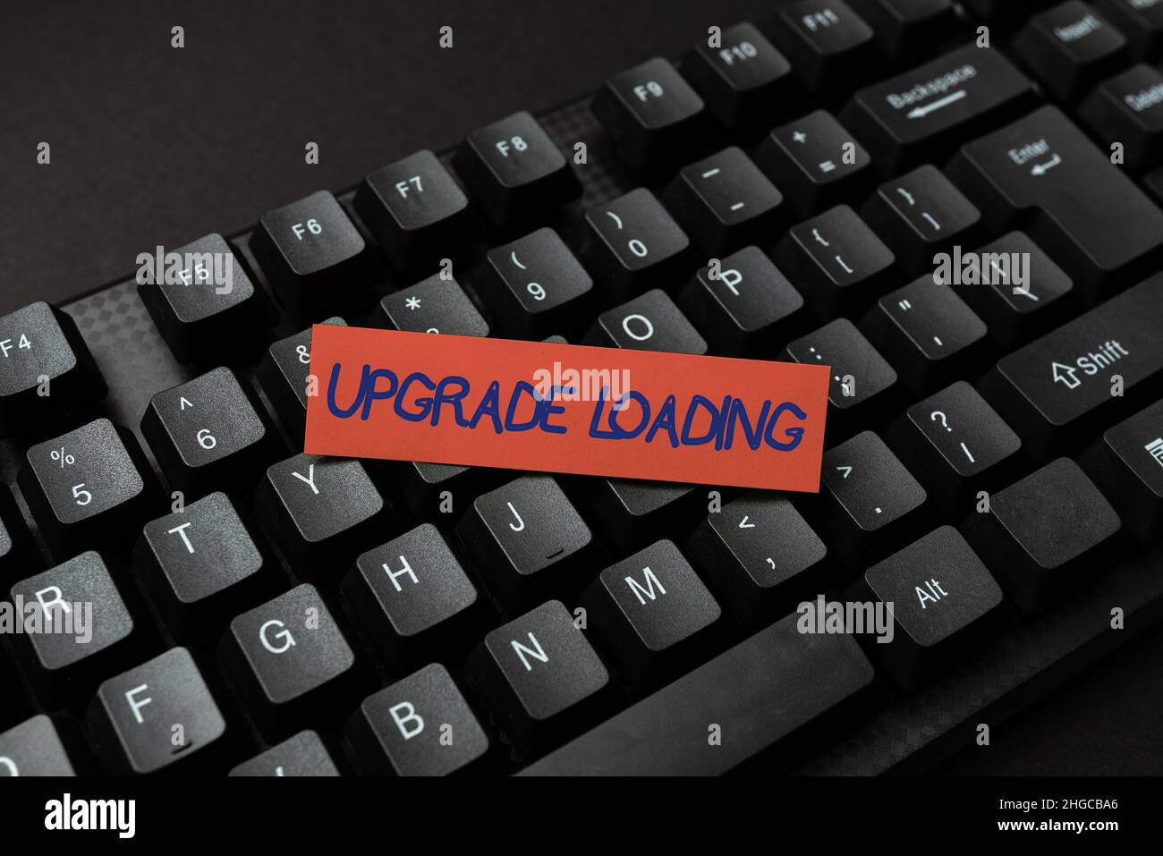 Hand writing sign Upgrade Loading. Concept meaning advancement of ...