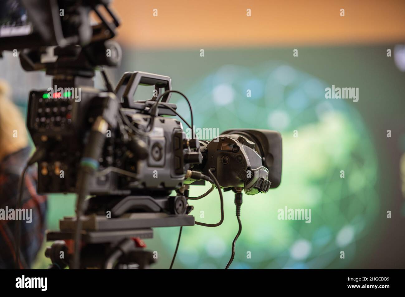 Modern broadcasting camera on a stand, ready to go live on an event ...