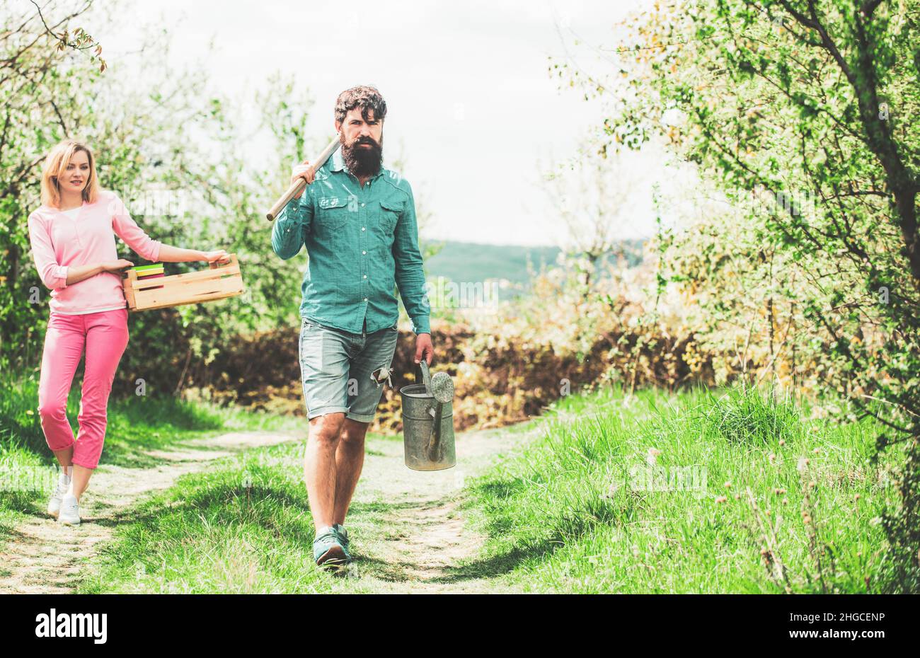 Farming gardening and people concept. Spring gardening routine. Wife ...