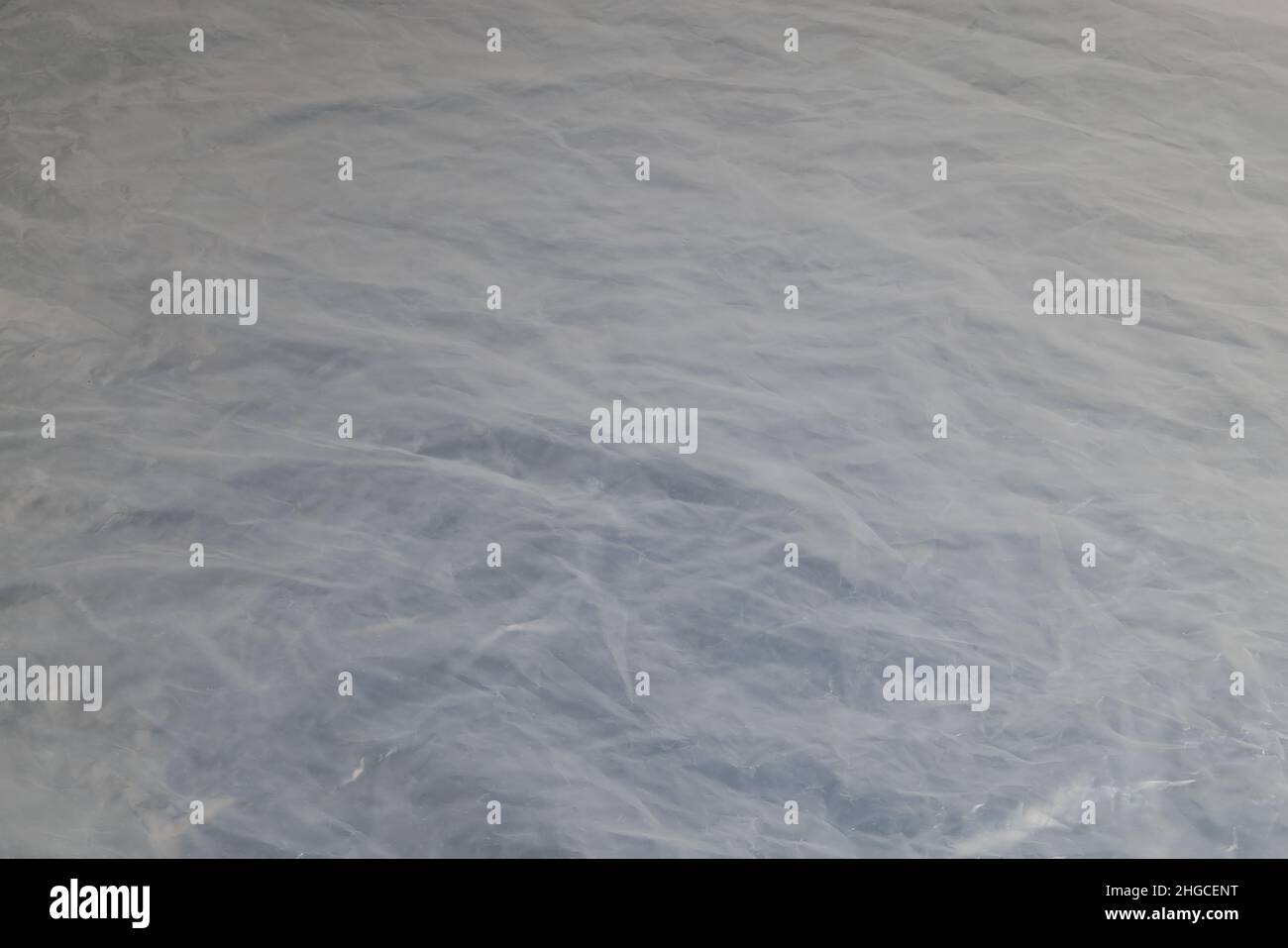 full frame background of flat crumpled semi-transparent polyethylene ...