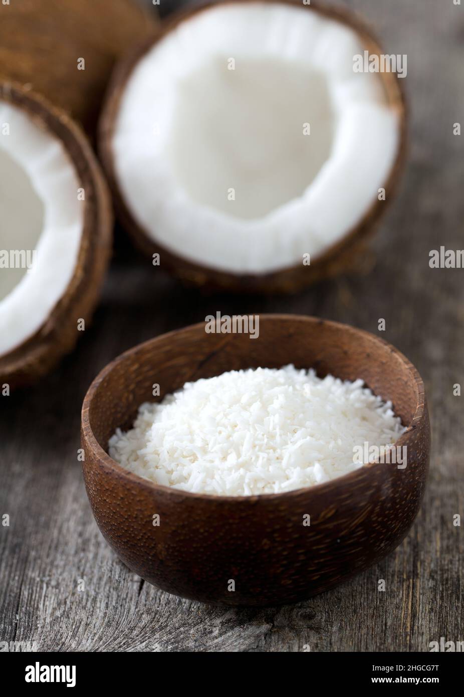 grated coconut on wooden surface Stock Photo - Alamy