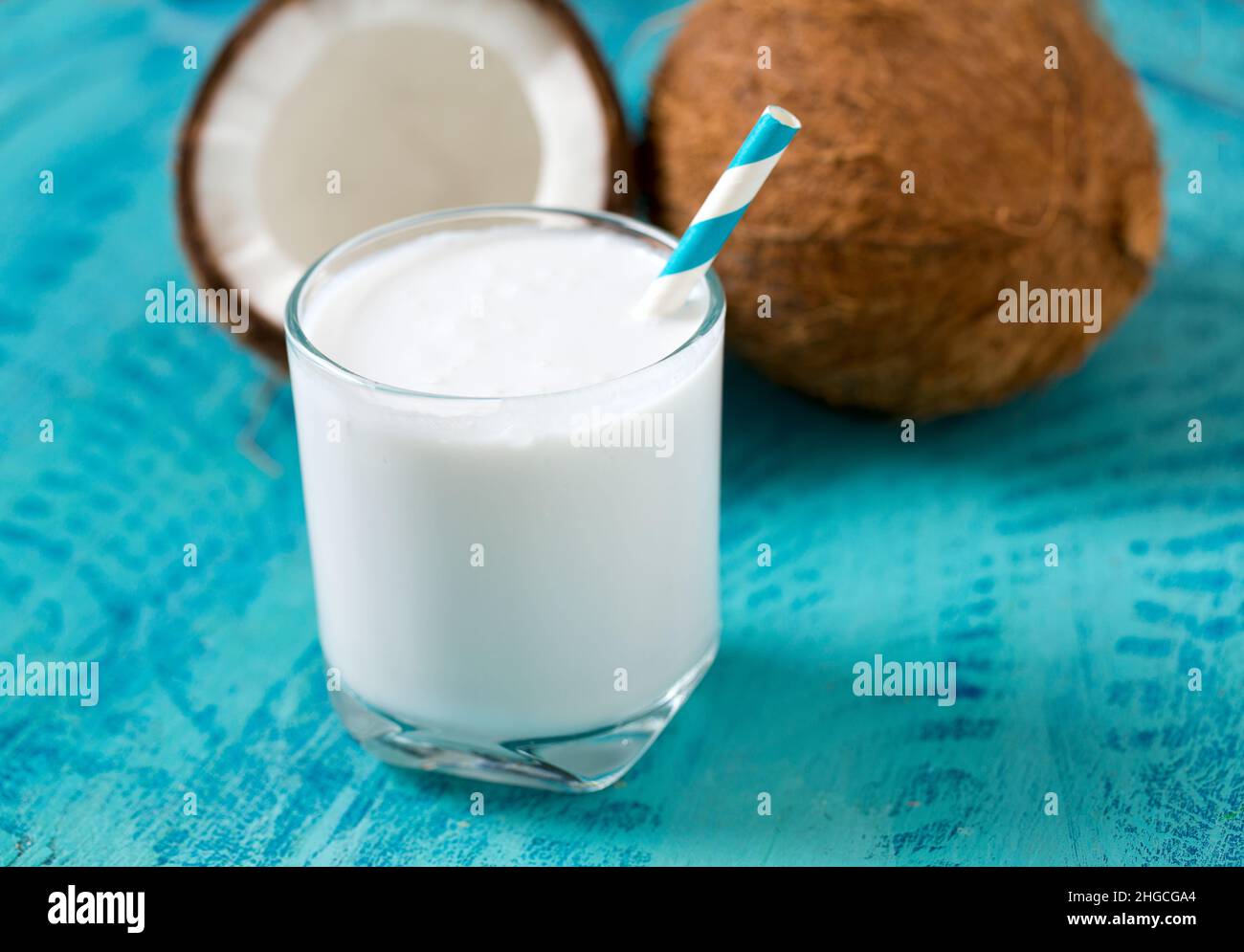 coconut milk on wooden surface Stock Photo - Alamy
