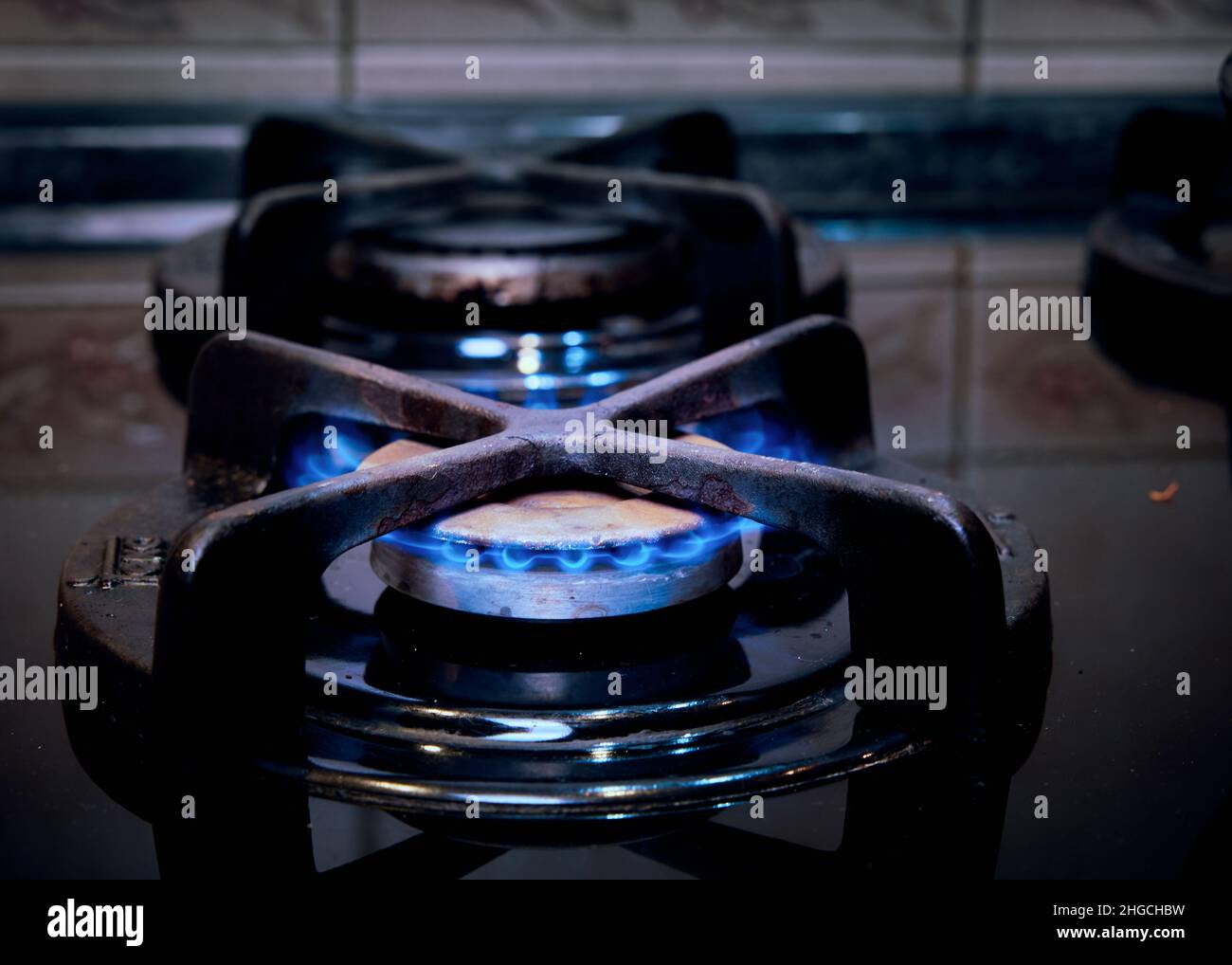 The flame of a burning gas burner on a kitchen stove Stock Photo - Alamy