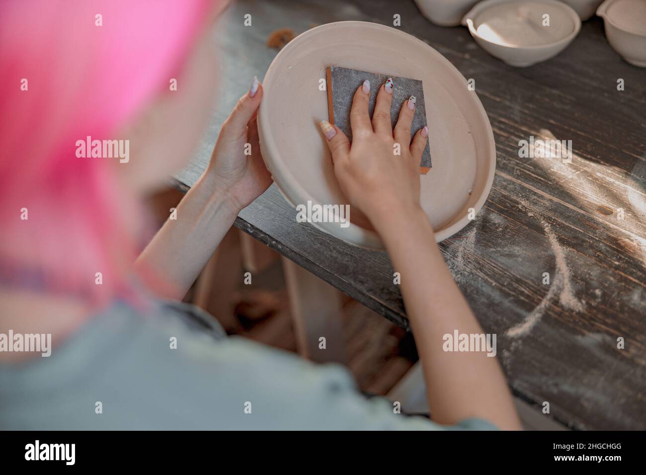 Potter hands making clay dish in pottery workshop Stock Photo - Alamy