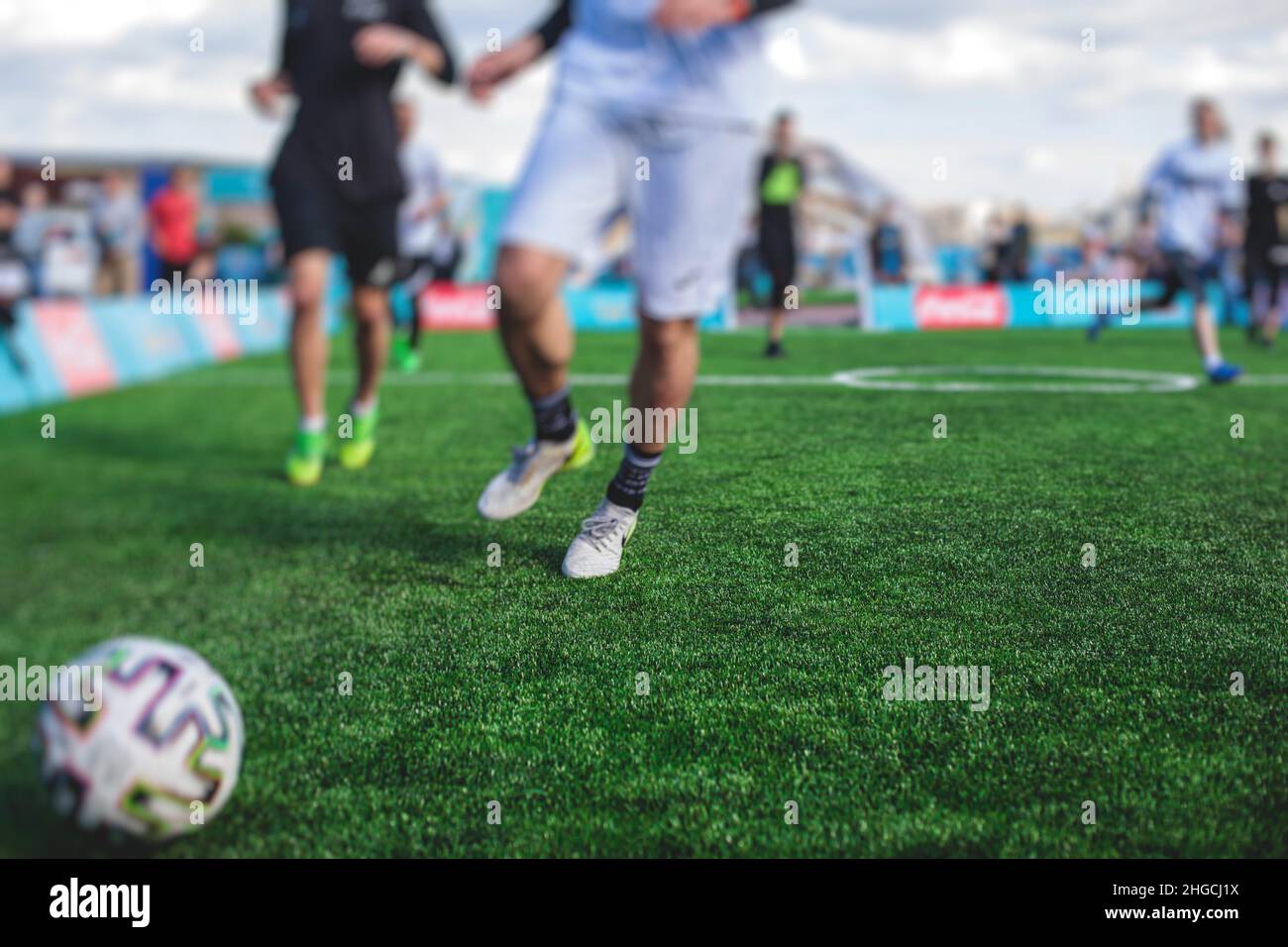 Street football outdoor game on an artificial astroturf vibrant lawn ...